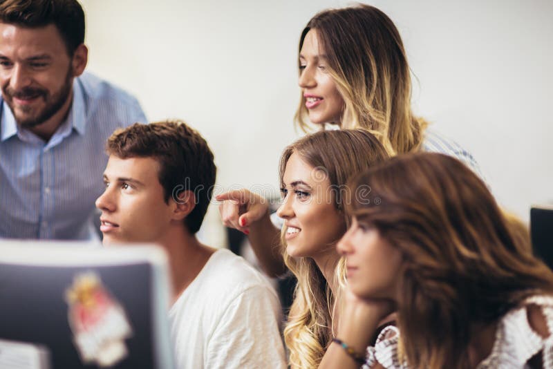 Students Sitting in a Classroom, Using Computers during Class Stock ...