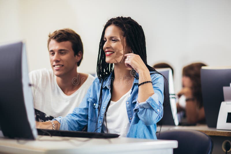 Students Sitting in a Classroom, Using Computers during Class Stock ...