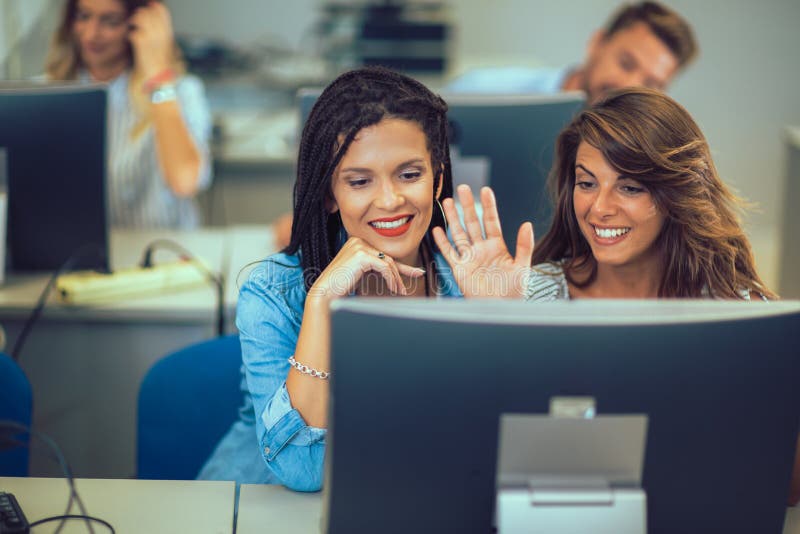 Students Sitting in a Classroom, Using Computers during Class Stock ...