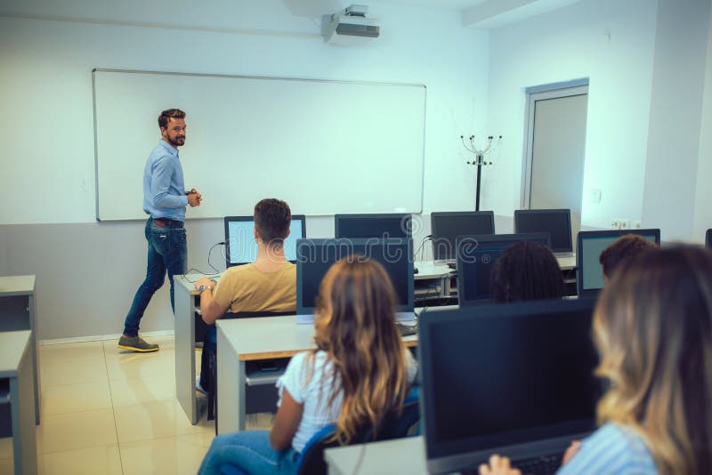 Students Sitting in a Classroom, Using Computers during Class Stock ...