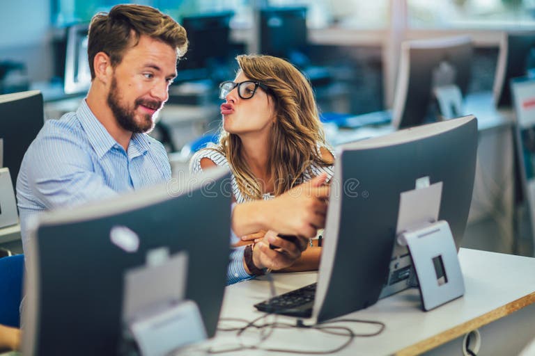 Students Sitting in a Classroom, Using Computers during Class Stock ...