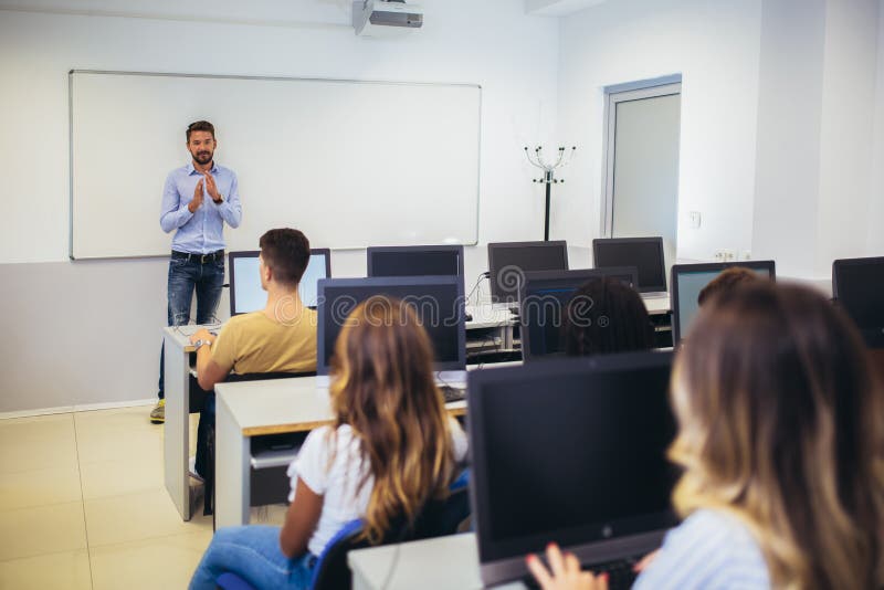 Students Sitting in a Classroom, Using Computers during Class Stock ...