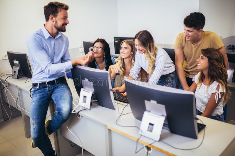 Students Sitting in a Classroom, Using Computers during Class Stock ...