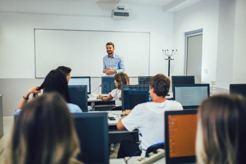 Students Sitting in a Classroom, Using Computers during Class Stock ...