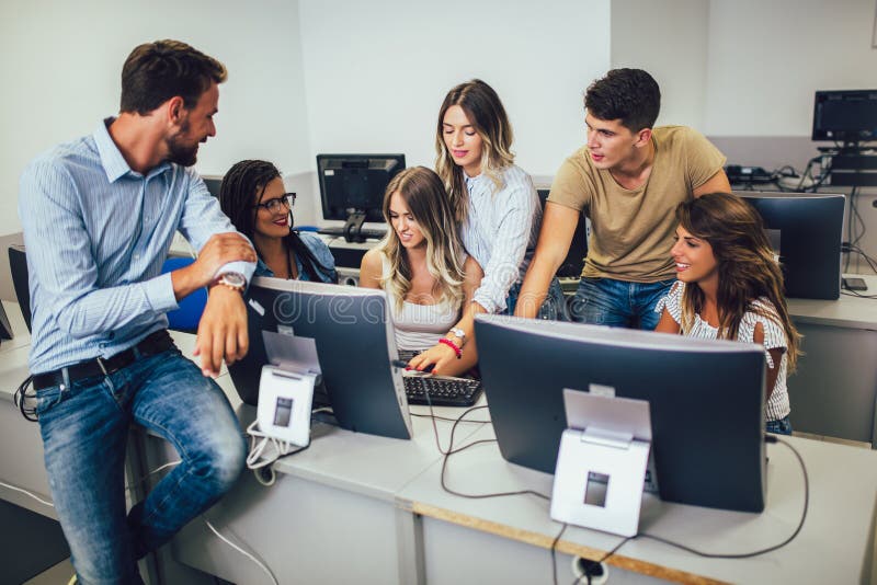 Students Sitting in a Classroom, Using Computers during Class Stock ...