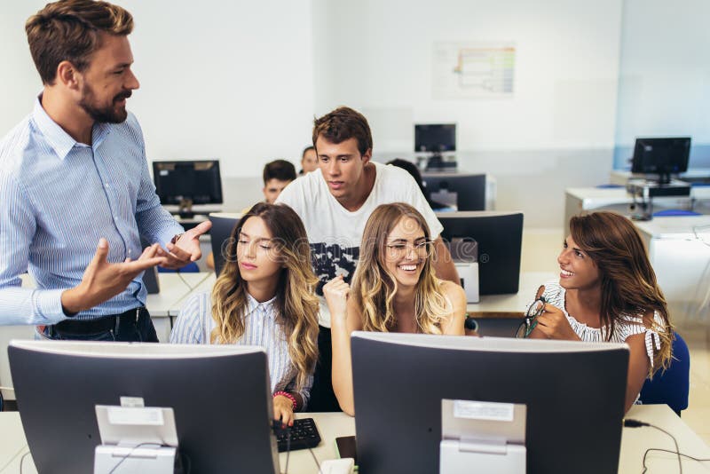 Students Sitting in a Classroom, Using Computers during Class Stock ...