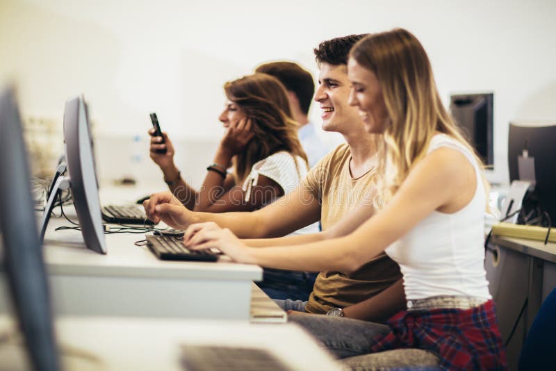 Students Sitting in a Classroom, Using Computers during Class Stock ...