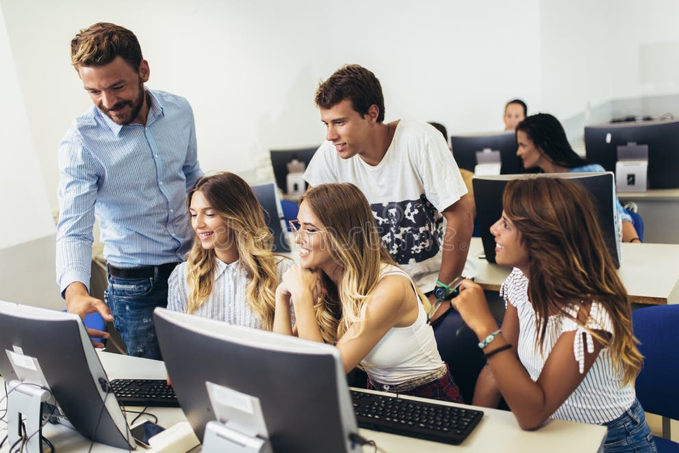 Students Sitting in a Classroom, Using Computers during Class Stock ...