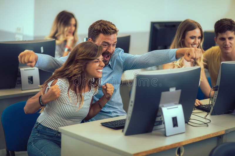 Students Sitting in a Classroom, Using Computers during Class Stock ...