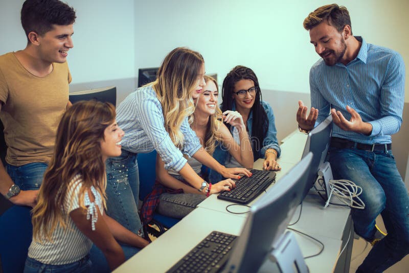 Students Sitting in a Classroom, Using Computers during Class Stock ...