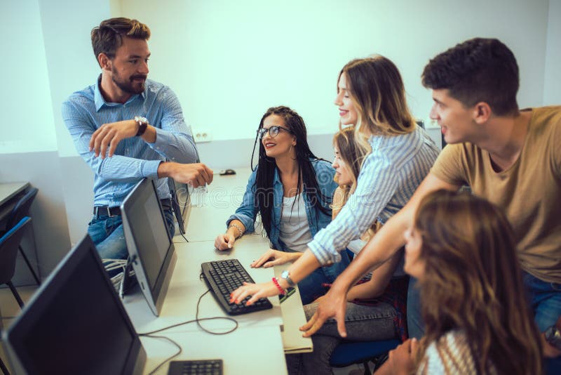 Students Sitting in a Classroom, Using Computers during Class Stock ...