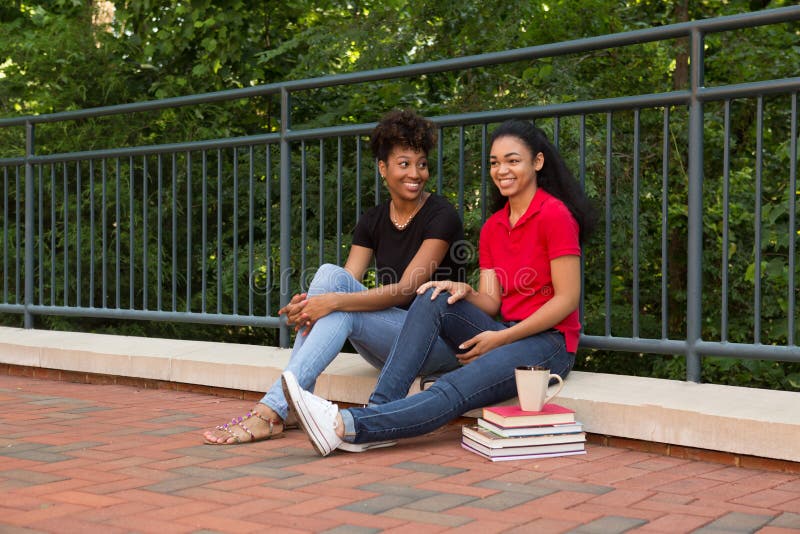 2 College Students on Campus Stock Photo - Image of outdoors, cheerful ...