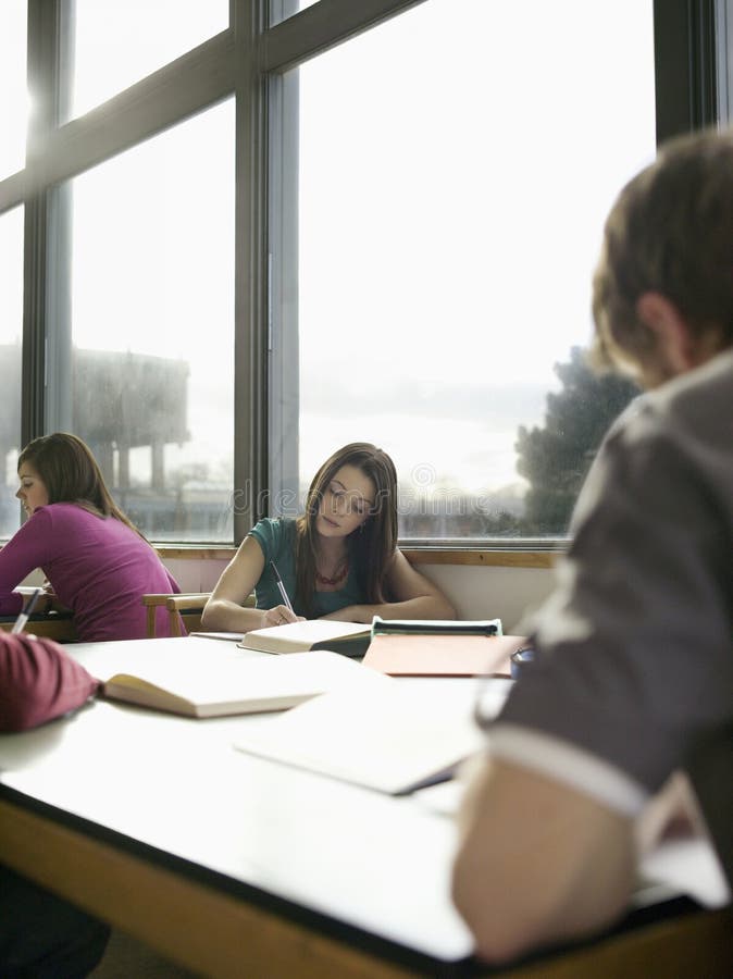 Two College Students Reading in Library Stock Photo - Image of adult ...