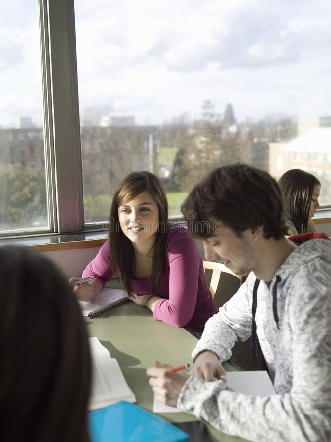 Two College Students Reading in Library Stock Photo - Image of adult ...