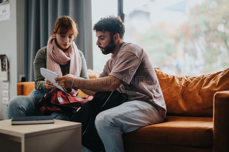 College Students Studying Together on a Cozy Couch in a Common Area ...