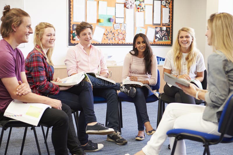 College Students with Tutor Having Discussion Stock Image - Image of ...