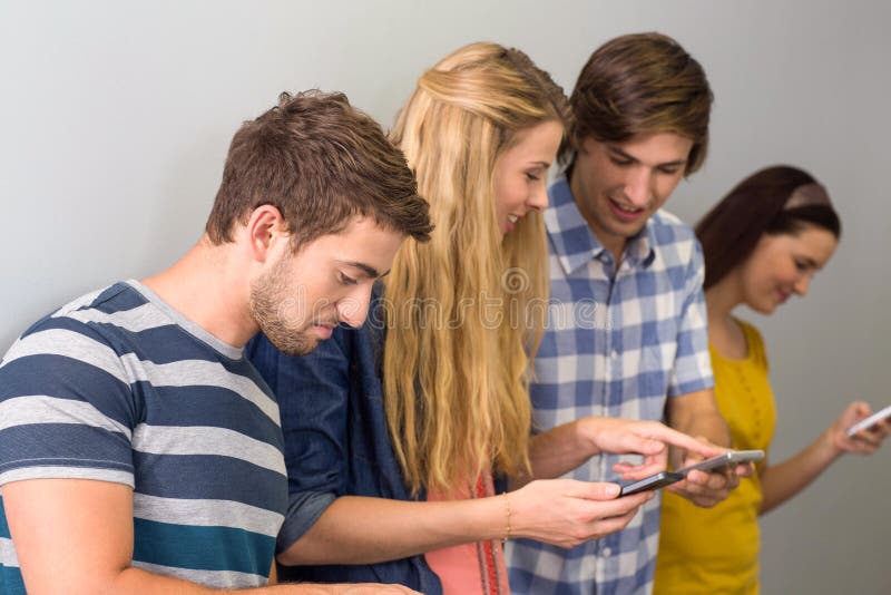 College Students Using Cellphones Stock Image - Image of campus ...