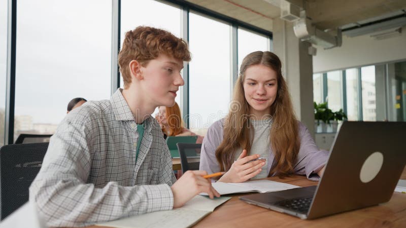 College Students Using Laptop while Sitting at Table Stock Footage ...