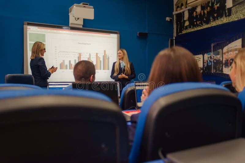 College Students Attending Classes. University Professor Writing on ...