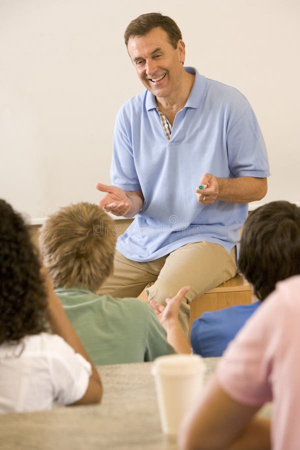 College Professor with Students Talking in Library Stock Image - Image ...