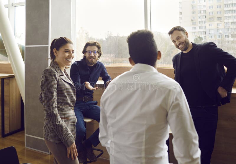 Collegues are Talking in Office during Work Break Near the Window ...