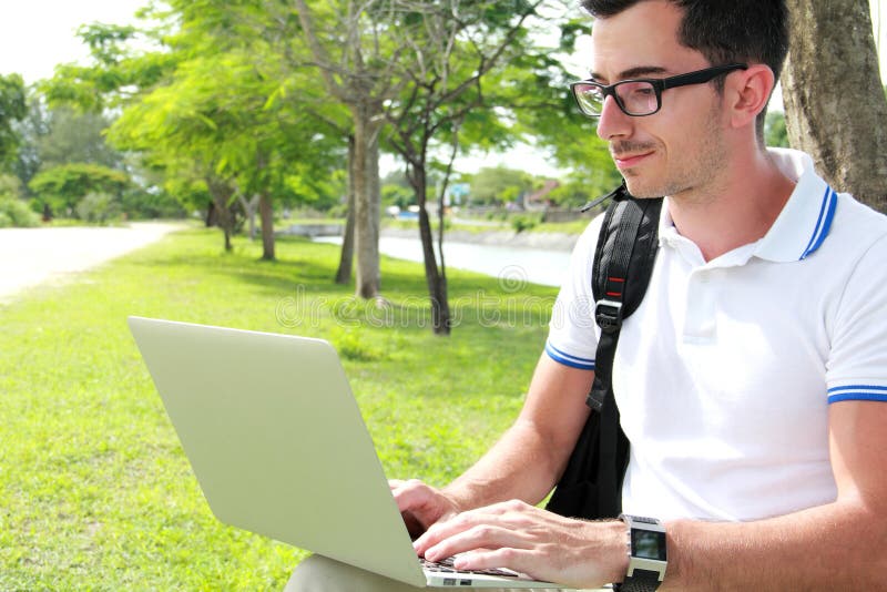 Colllege Student Working on Assignments Using Laptop Stock Image ...