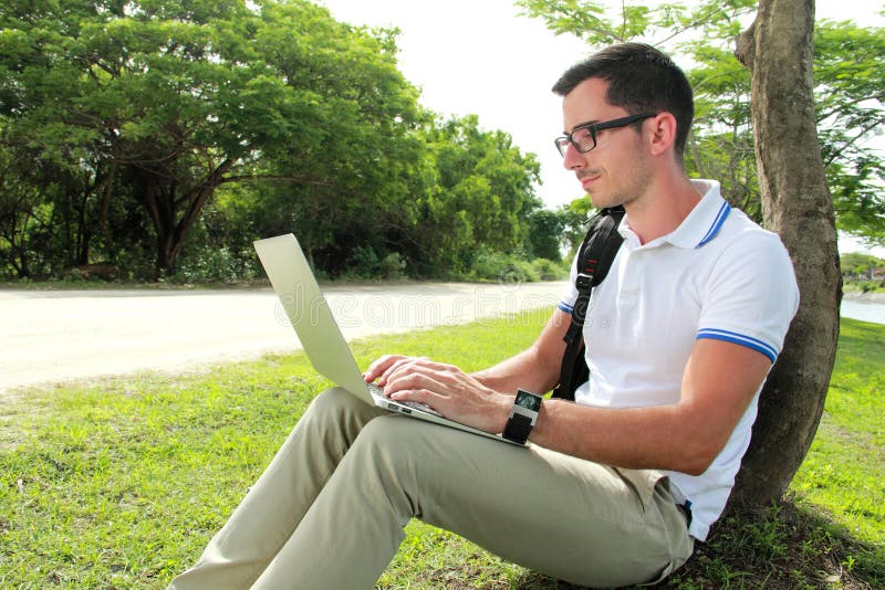 Colllege Student Working on Assignments Using Laptop Stock Photo ...