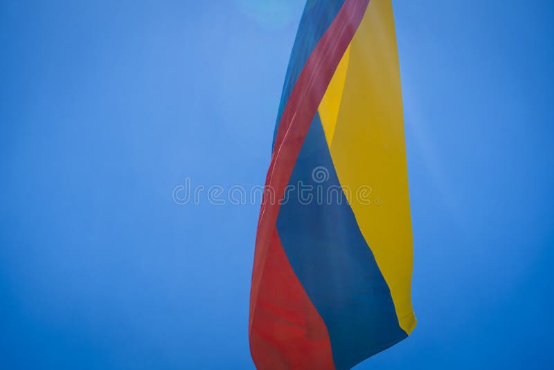 Colombia Flag Waving in a Blue Cloudy Sky Stock Photo - Image of ...