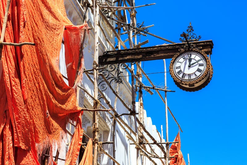Colonial Clock Hanging on an Old Colonial Building Stock Image - Image ...