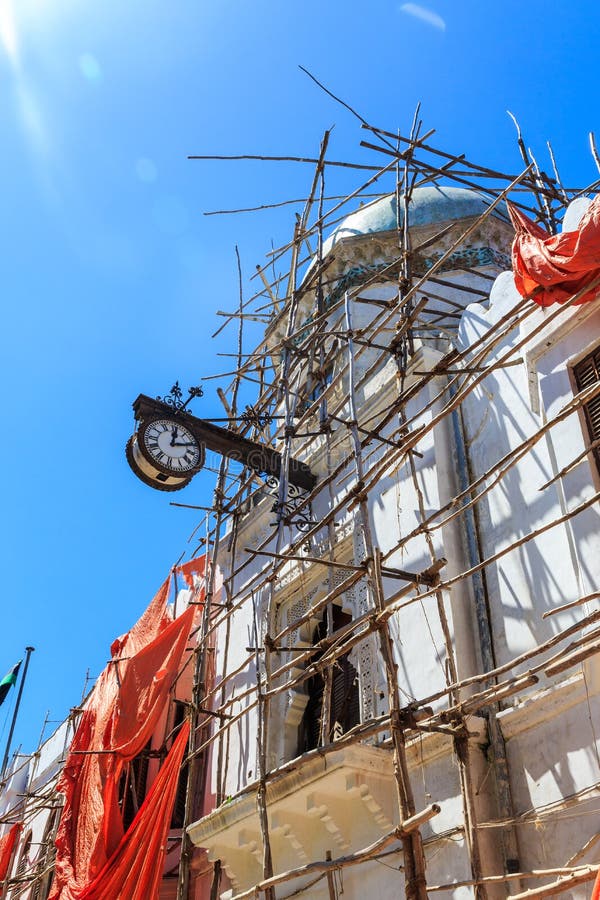 Colonial Clock Hanging on an Old Colonial Building Stock Photo - Image ...