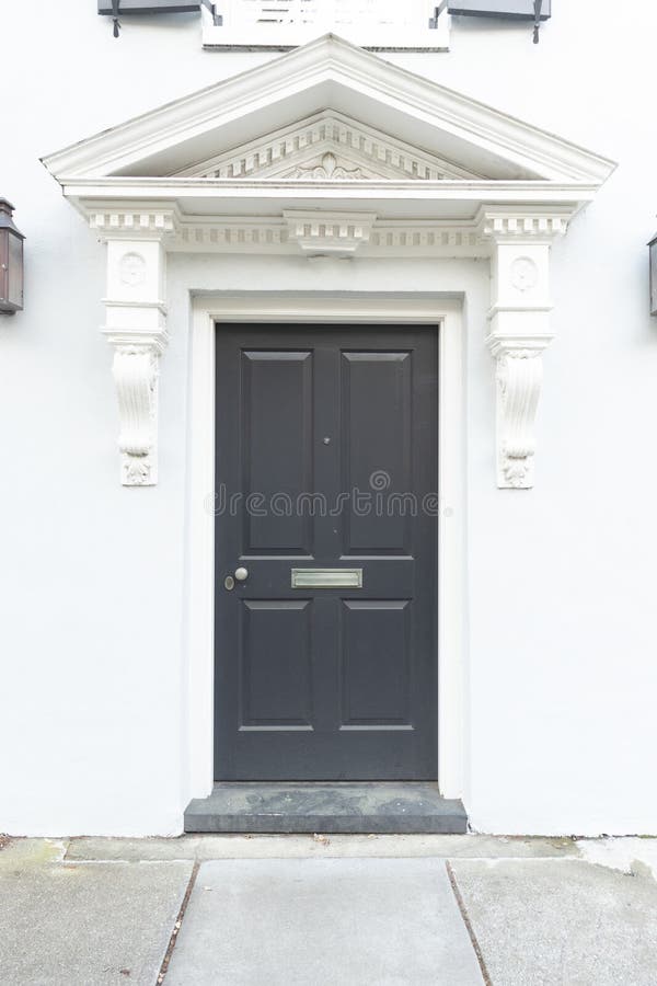 A Colonial Style Front Door with an Eccentric Door Frame Stock Image ...