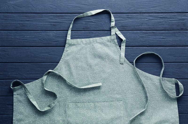 Color Apron with Pattern on Grey Wooden Table, Top View Stock Photo ...