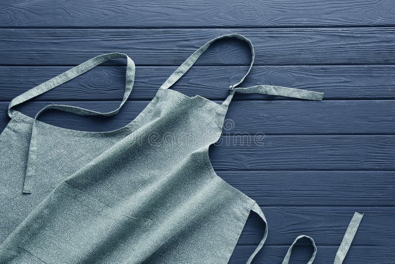 Color Apron with Pattern on Grey Wooden Table, Top View Stock Image ...