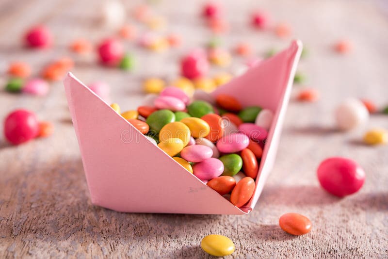 Color candy on paper boat stock image. Image of brown - 89636991