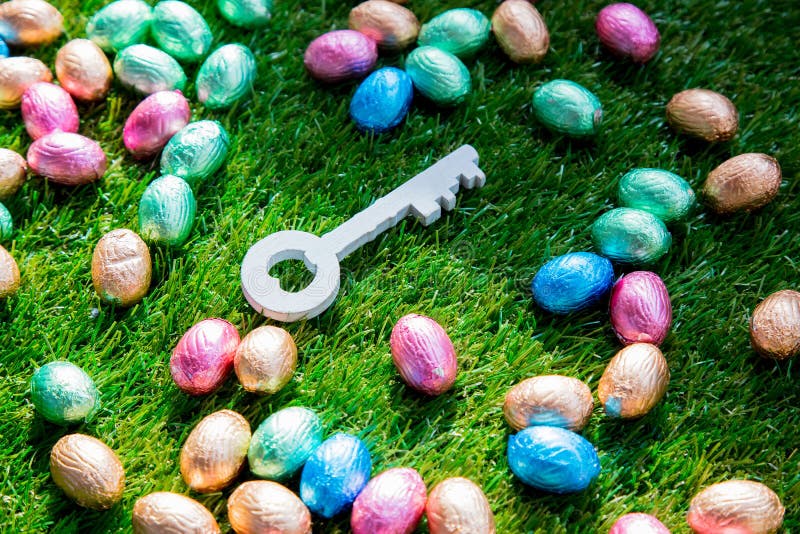 Color Chocolate Easter Eggs and Key Stock Photo - Image of grass ...