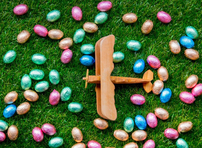 Color Chocolate Easter Eggs and Wooden Airplane Stock Photo - Image of ...