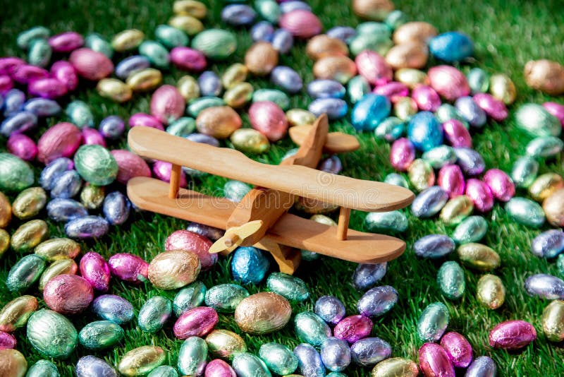 Color Chocolate Easter Eggs and Wooden Airplane Stock Photo - Image of ...