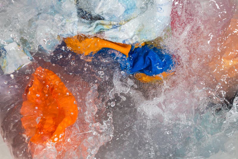 Color Clothes that Float Above the Water in the Washing Machine. Stock ...