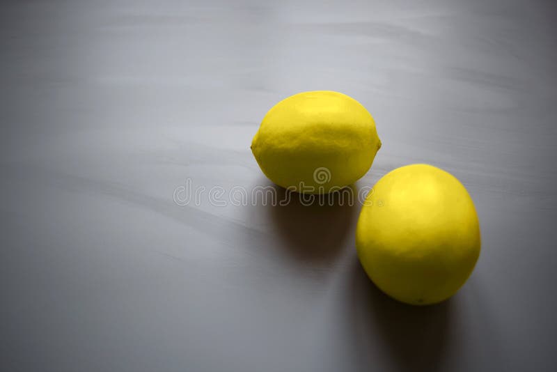 Color Concept of 2021. Illuminating Lemons on a Ultimate Gray ...