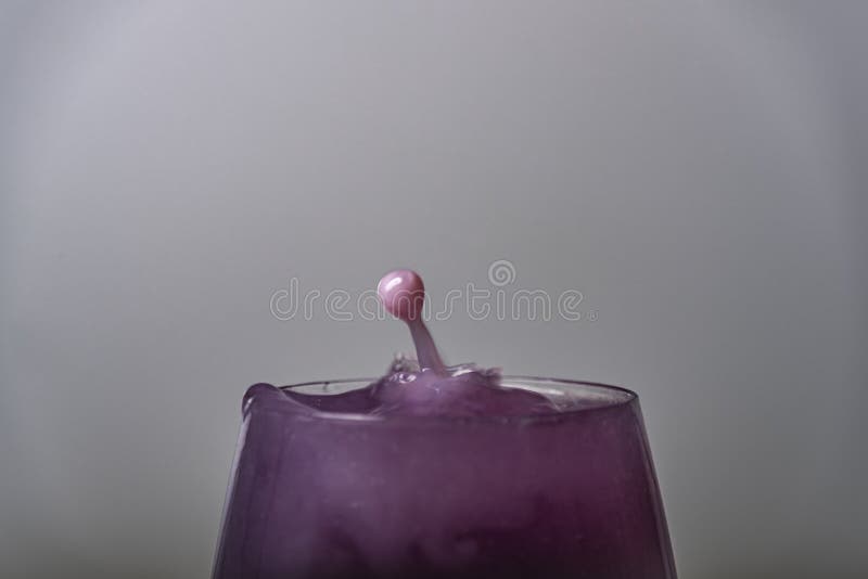 Color Drops Fall To Wine Glass with Color Liquid Stock Image - Image of ...