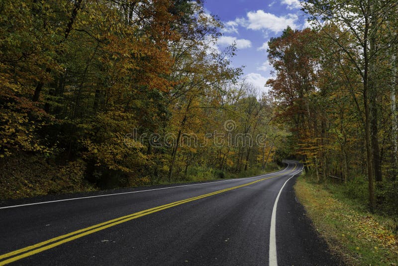 Color of fall road scene stock image. Image of bridge - 162545323