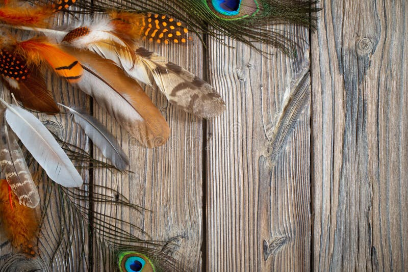 Color Feathers on Old Wooden Background Stock Photo - Image of detail ...