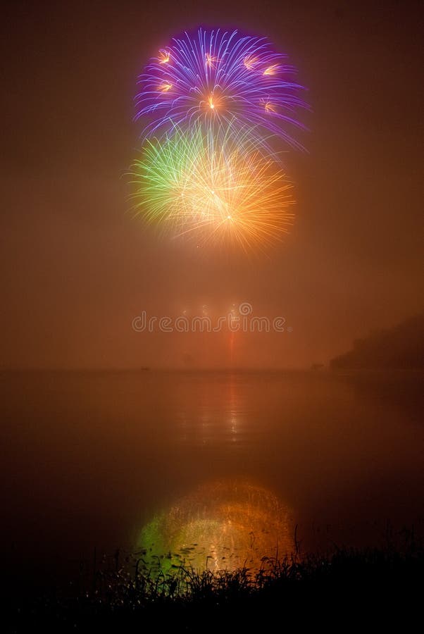 Color fireworks on lake stock photo. Image of explosion - 15357332