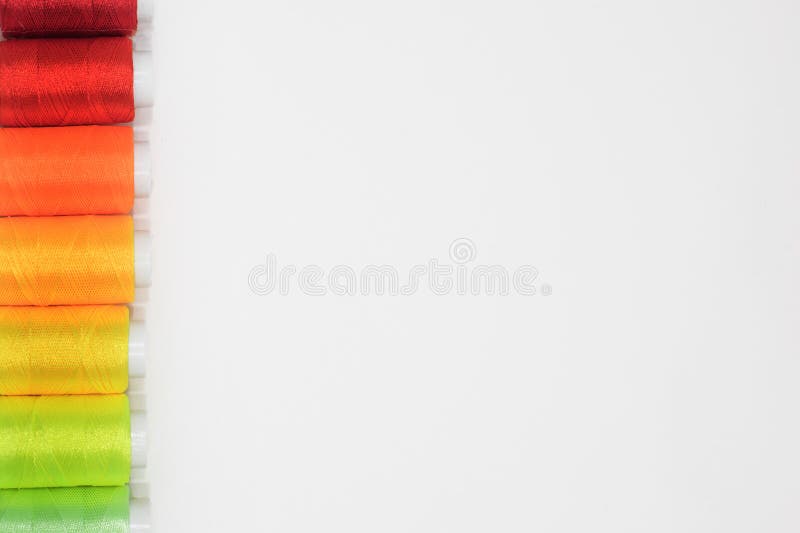 Color Flow of Thread Spools on Light Background with Right-Side Copy ...