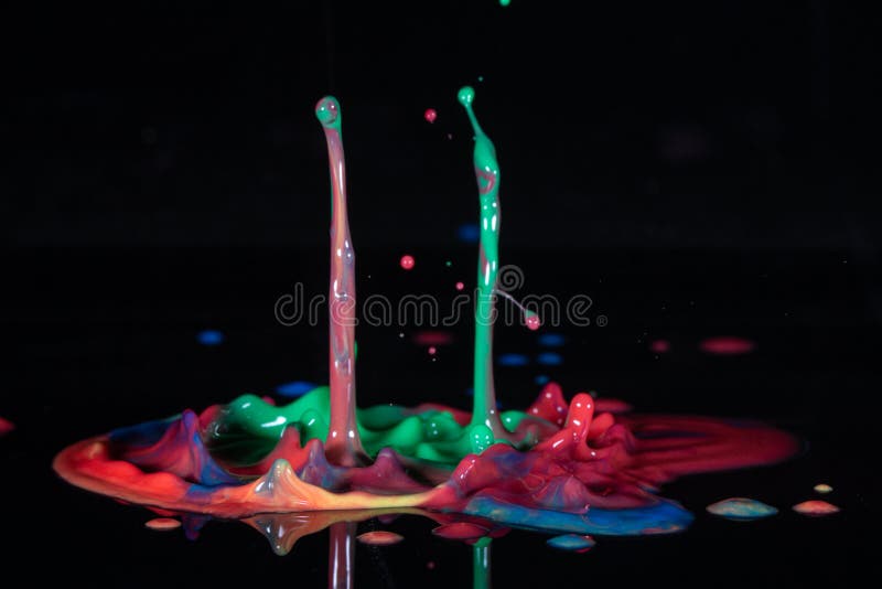 Color Ink Splash on a Black Background Stock Image - Image of green ...