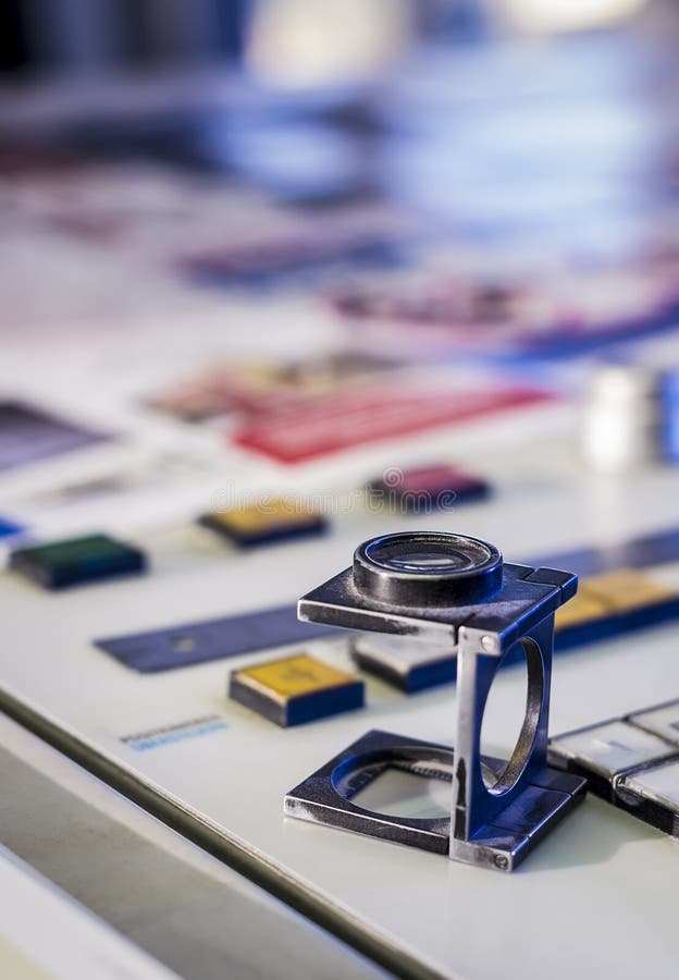 Printing Process with Magnifying Glass and Color Swatches Stock Image ...