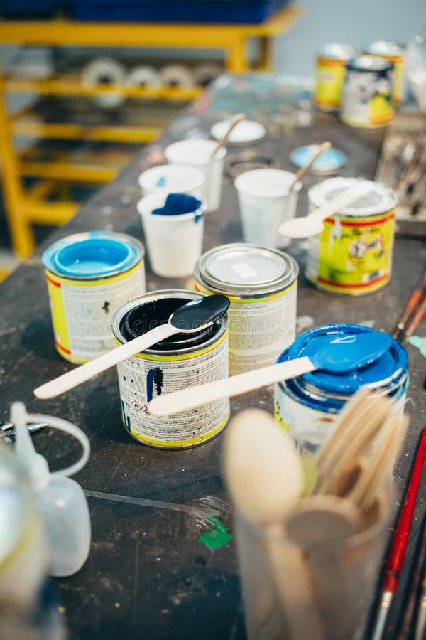 Color Paint Jars and Painting Accessories in Studio Stock Photo - Image ...