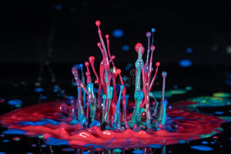 Color Paint Splash on a Black Background Stock Image - Image of wave ...
