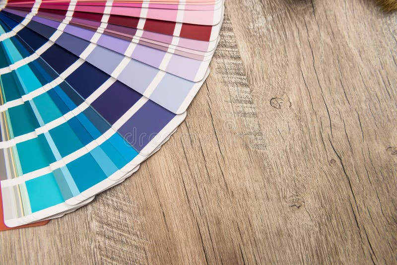 Color Palette Guide and Paint Brush Roller on Wood Board Stock Photo ...