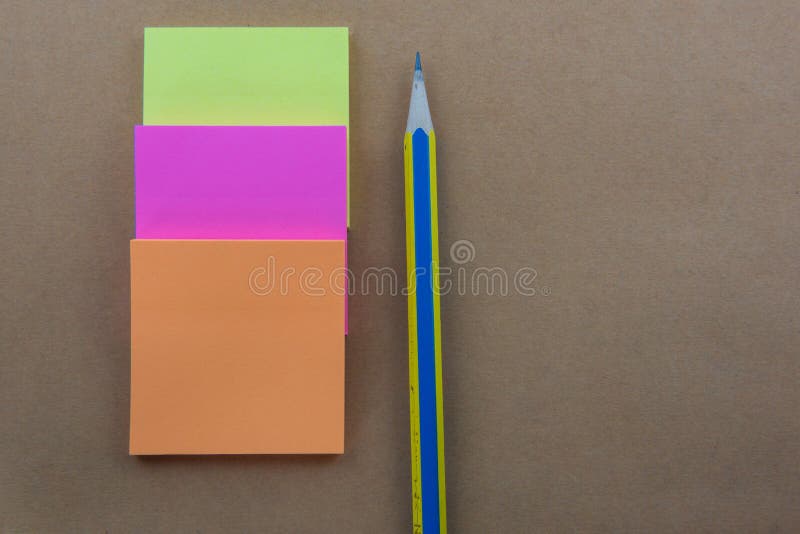 Color Paper Notes with Sticky Note on Brown Background Stock Photo ...